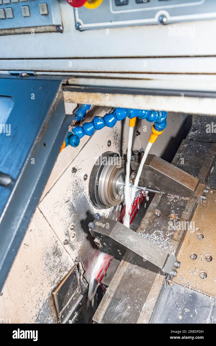 Milling metalworking process. Industrial CNC metalworking with vertical ...