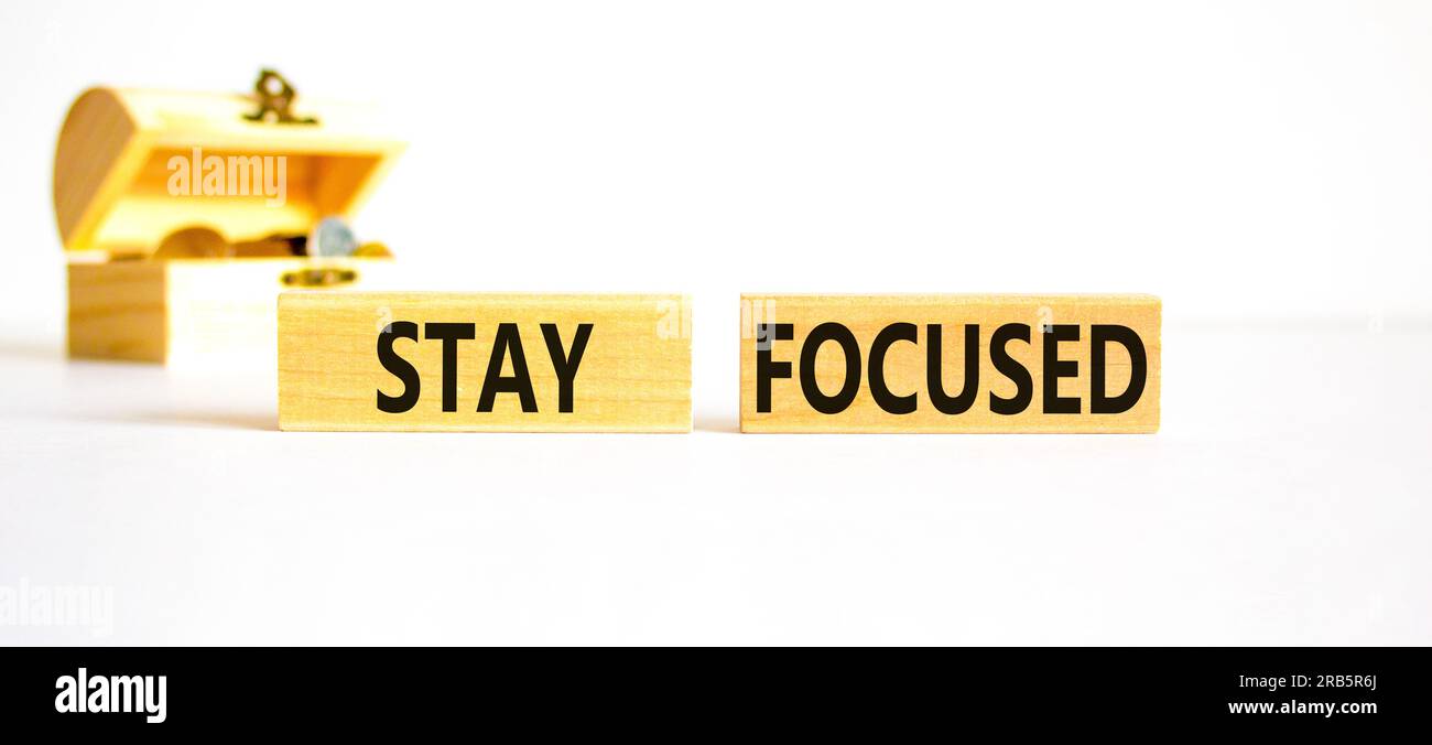 Stay focused symbol. Concept words Stay focused on wooden blocks on a ...