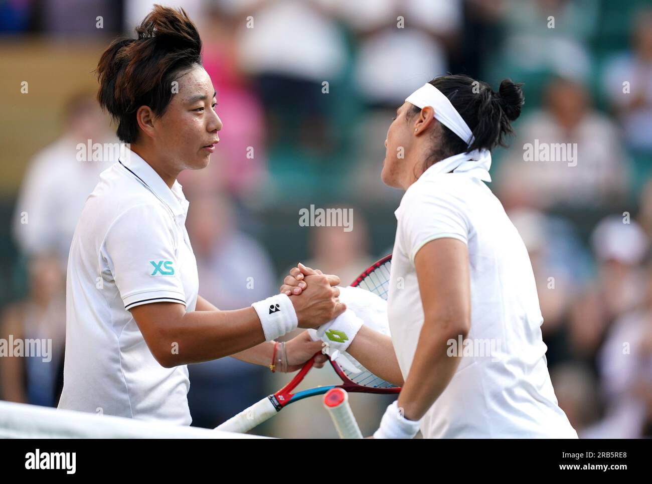 Ons Jabeur (right) celebrates victory over Zhuoxuan Bai on day five of ...