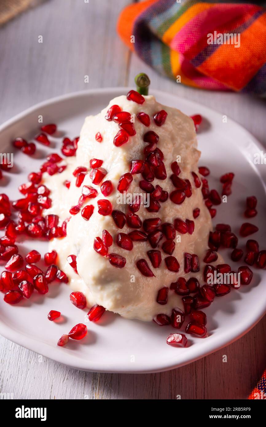 Chiles en Nogada, Typical dish from Mexico. Prepared with poblano chili ...