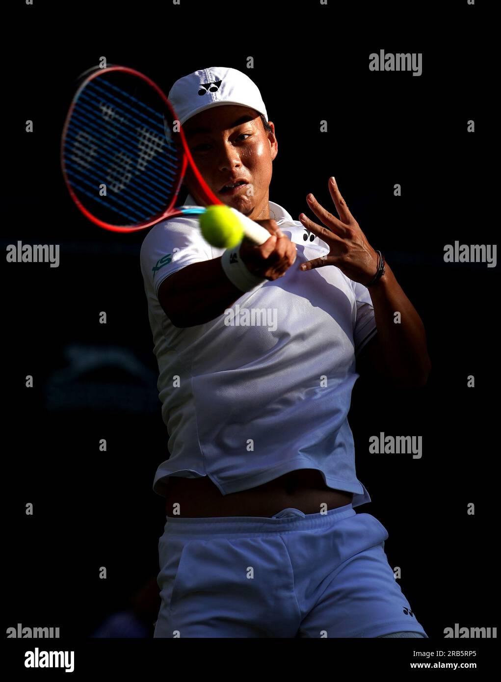 Zhuoxuan Bai in action against Ons Jabeur (not pictured) on day five of ...