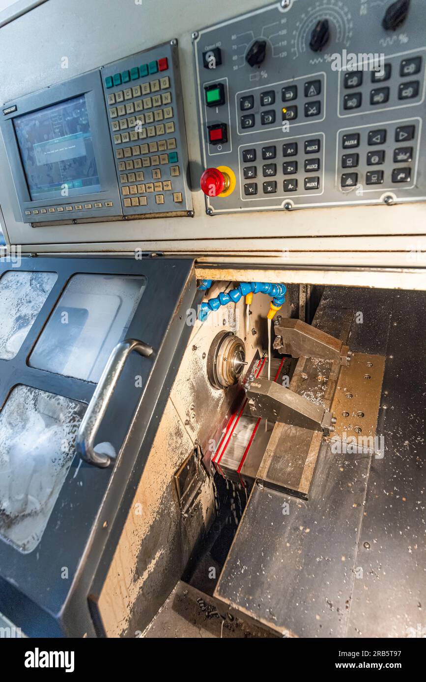 Milling metalworking process. Industrial CNC metalworking with vertical ...