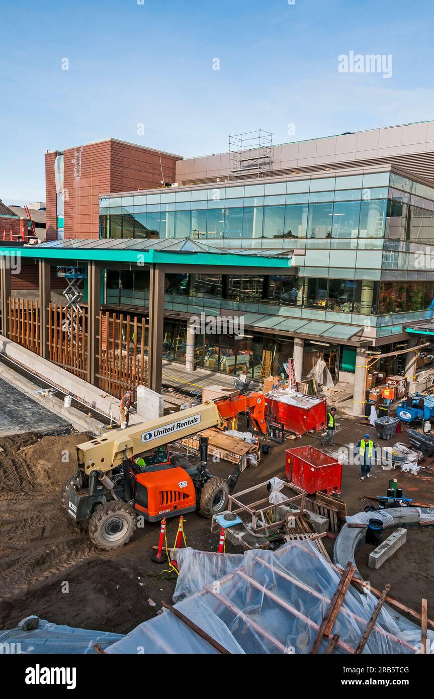 Workers and equipment in construction of a healthcare facility Stock ...