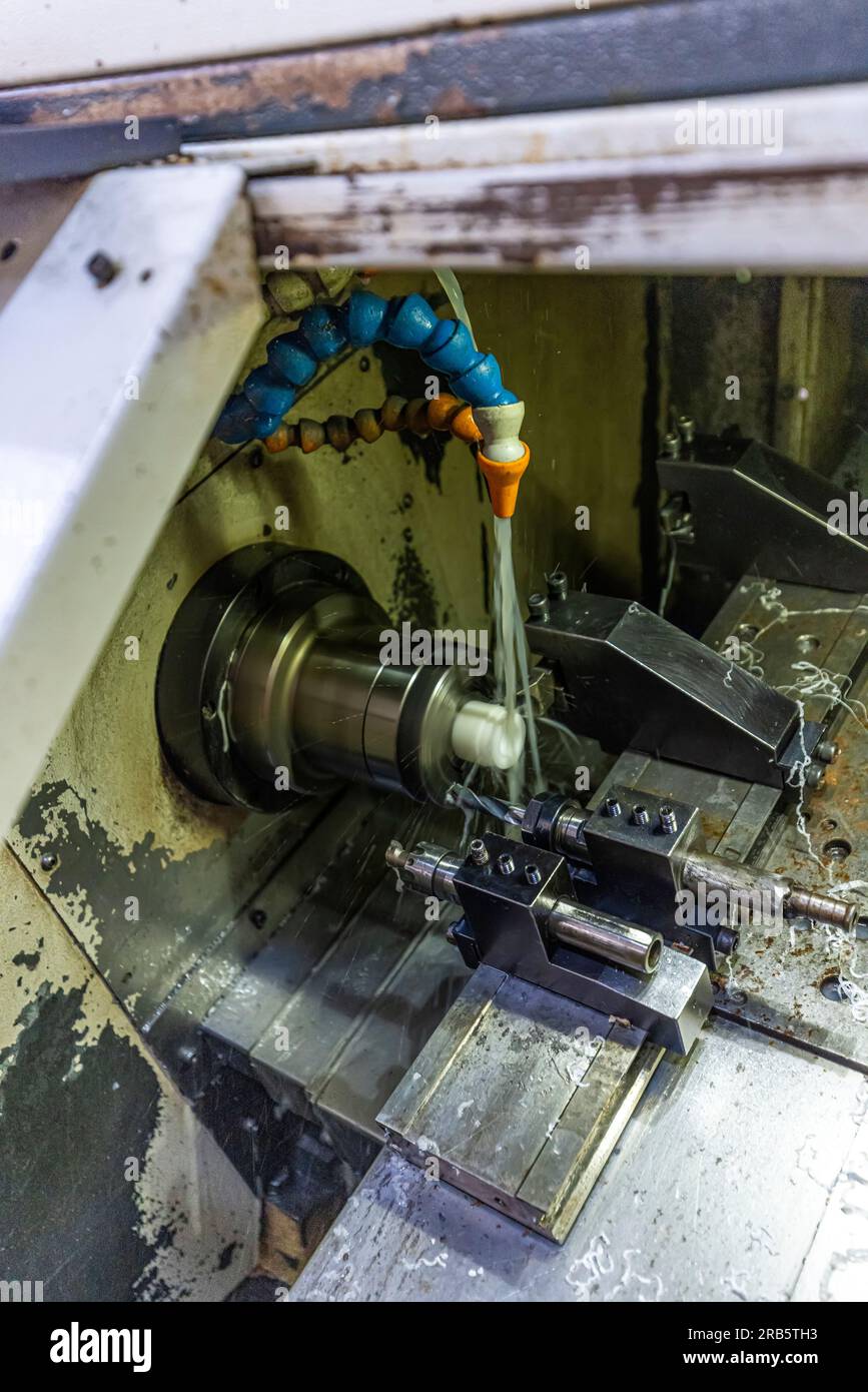 Milling metalworking process. Industrial CNC metalworking with vertical ...