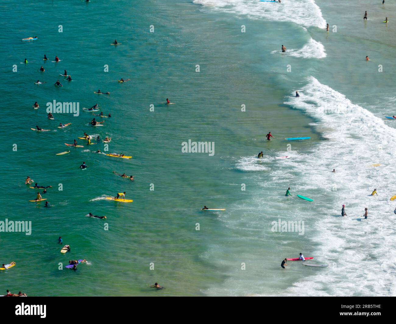 Aerial view of Ipanema beach. People sunbathing and playing on the beach, sea sports. Surfing ...