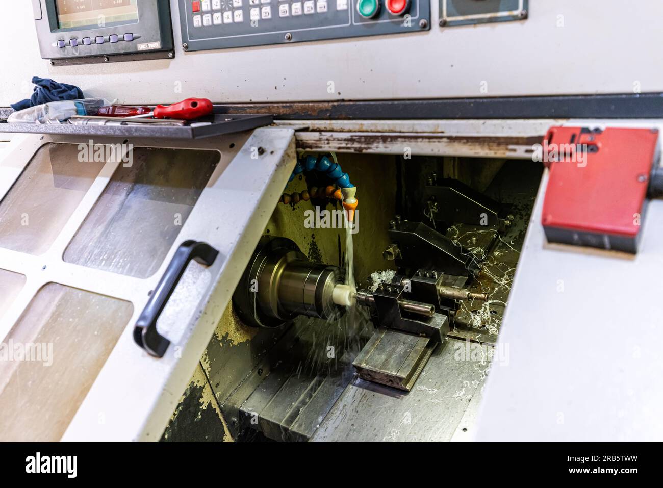 Milling metalworking process. Industrial CNC metalworking with vertical ...