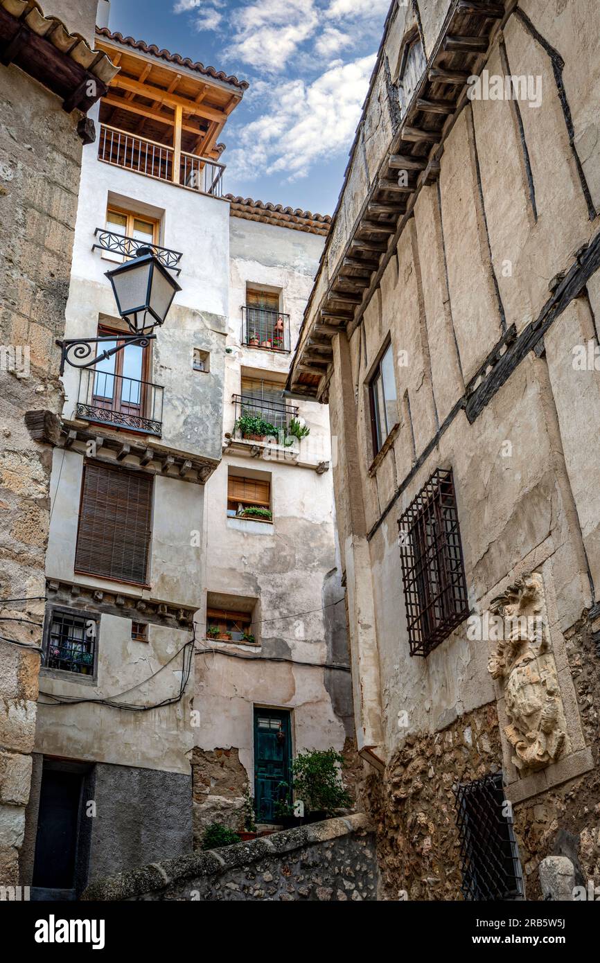 Alley with tall and narrow medieval buildings of the world heritage old ...