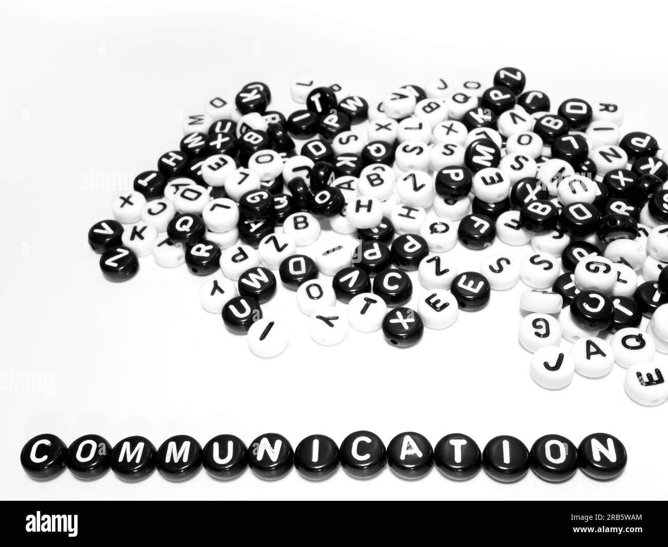 Heap of round letters black and white and communication word written by ...