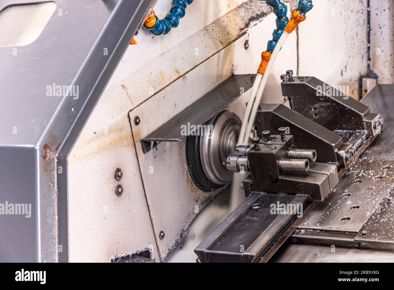 Milling metalworking process. Industrial CNC metalworking with vertical ...