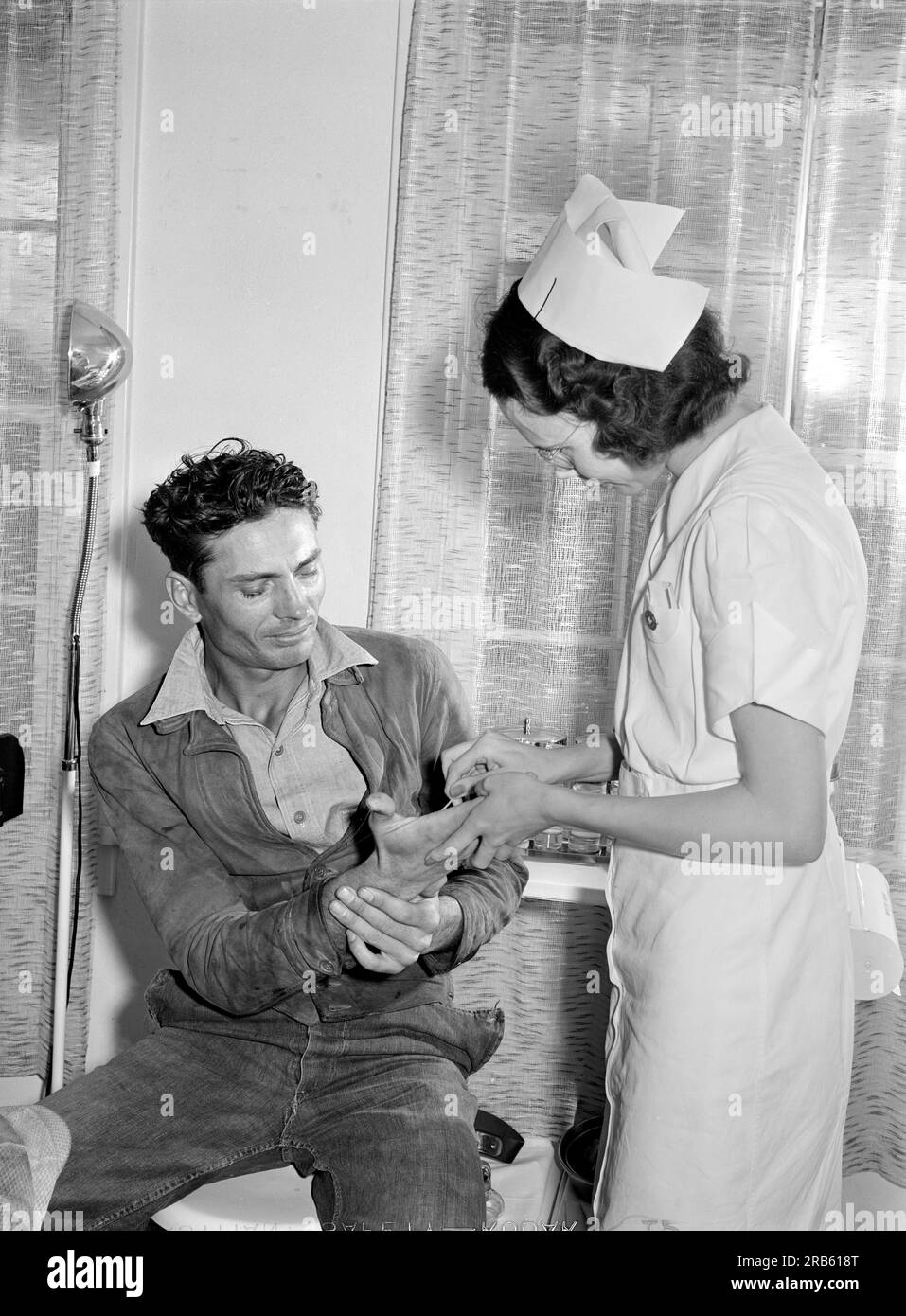 Old man receiving treatment Black and White Stock Photos & Images - Alamy