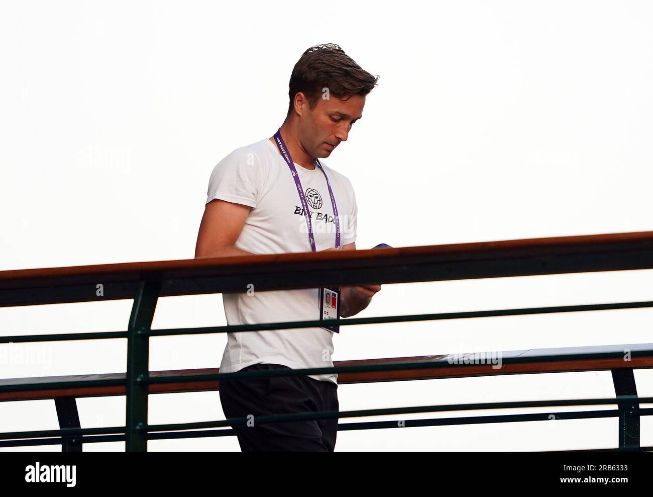 Liam Broady walks across a bridge within the grounds on day five of the ...