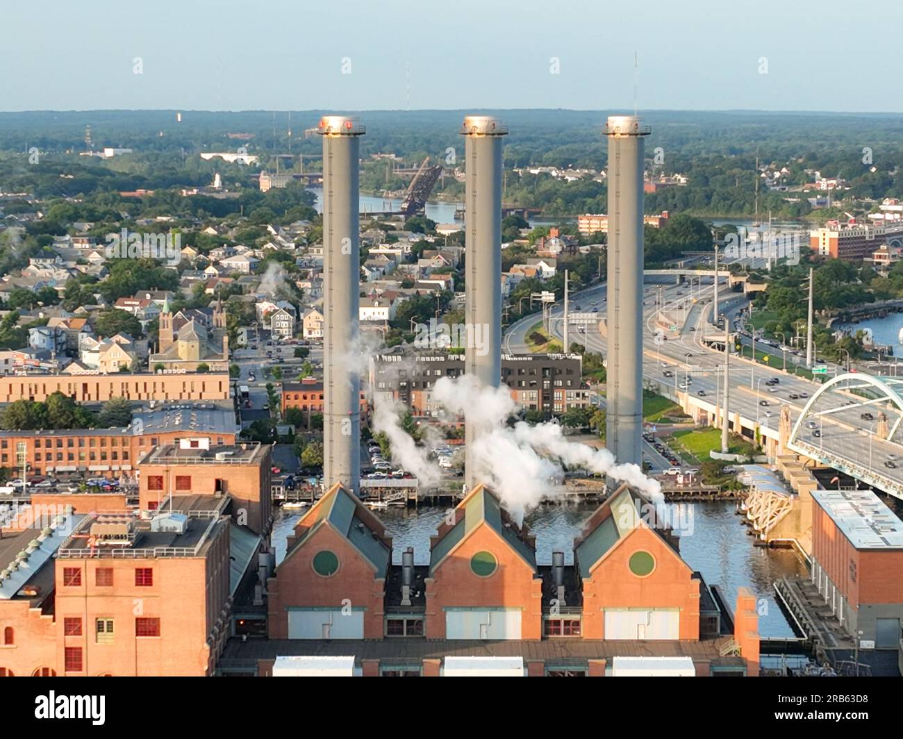 Late afternoon summer aerial image of the power plant located downtown ...