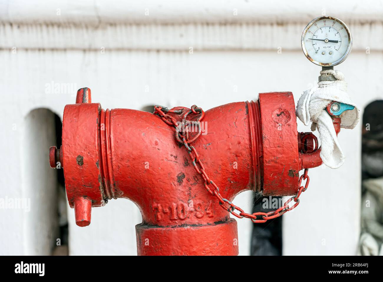 A hydrant with a pressure gauge on a city street Stock Photo - Alamy