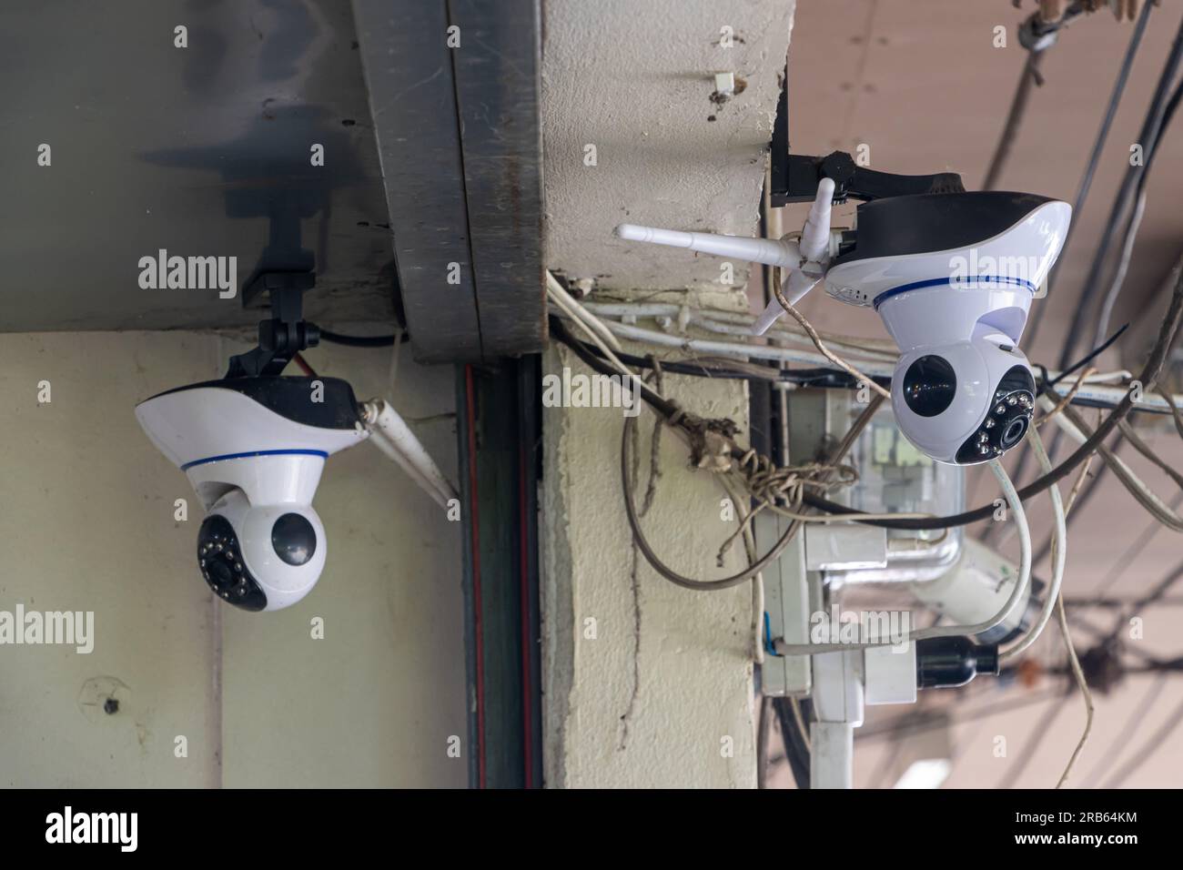 Surveillance cameras attached to the ceiling at the entrance to the ...