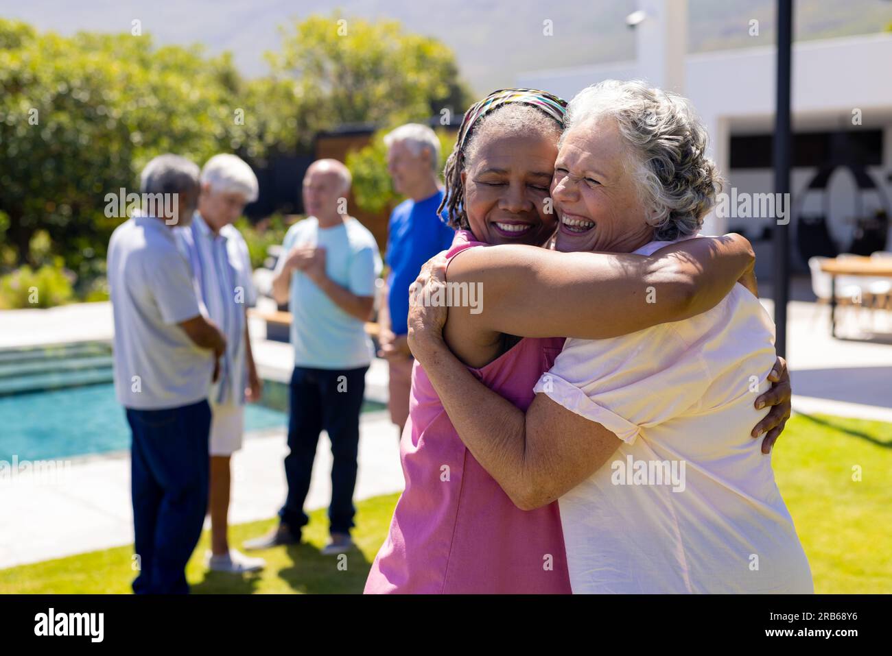 Group of happy senior diverse people embracing and smiling in garden ...