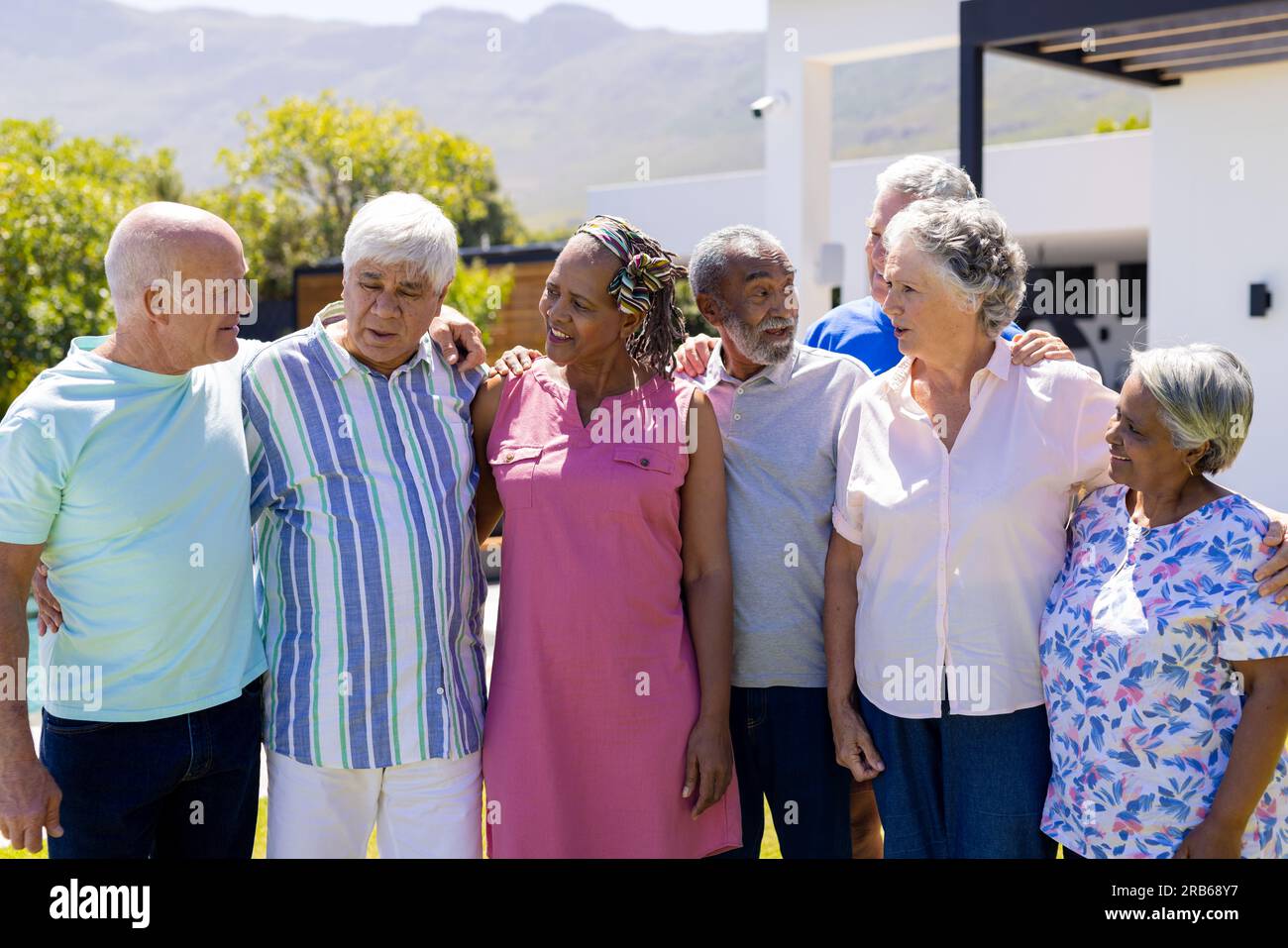Group of happy senior diverse people embracing and smiling in garden ...