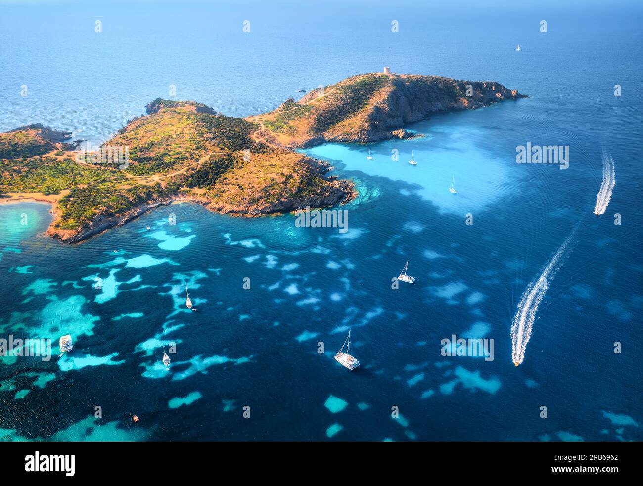 Aerial view of island, sea bay with clear azure water, boats Stock ...