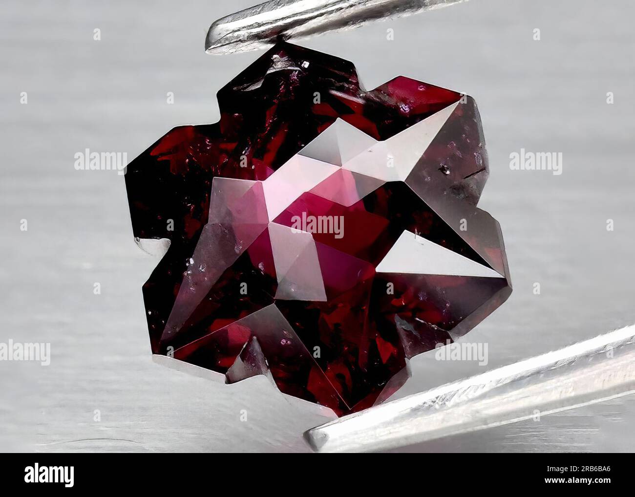 Natural gemstone red rhodolite garnet on white background Stock Photo ...