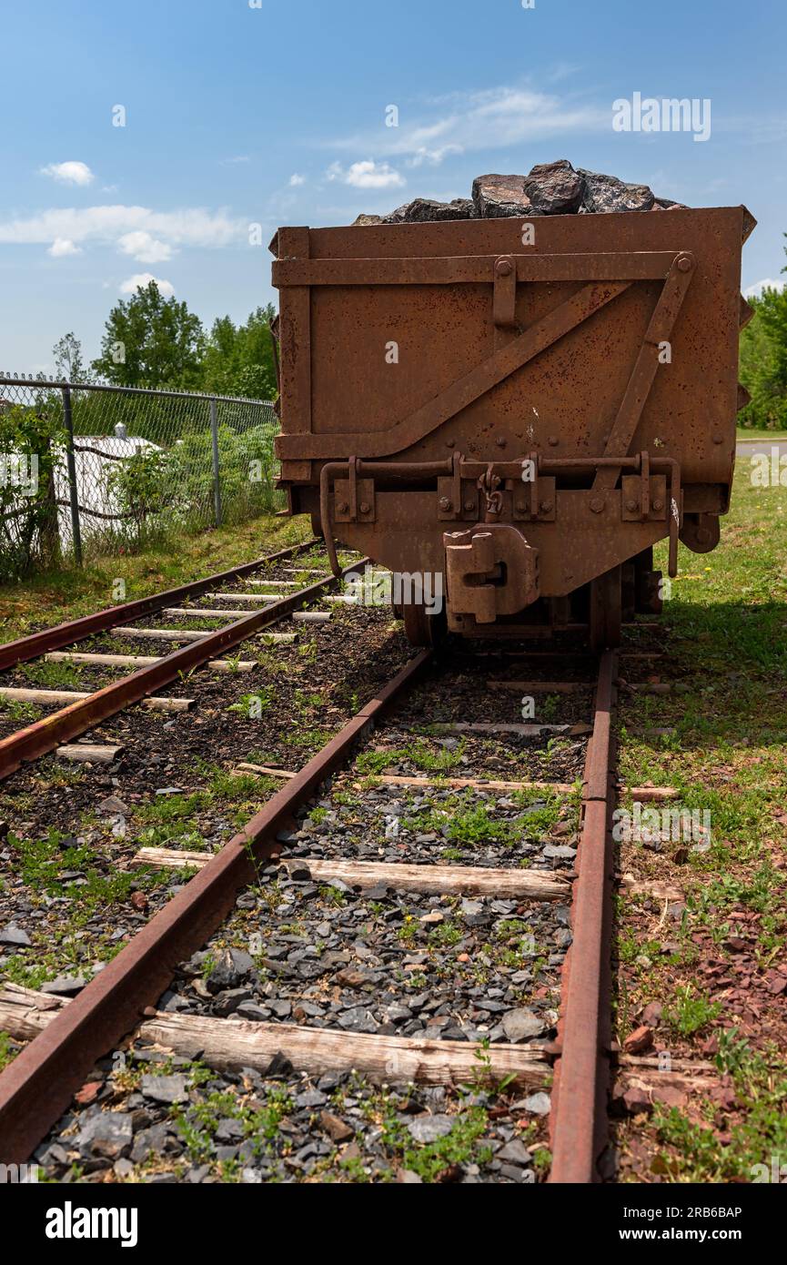 Loaded Ore Cart on Railroad Tracks - abandoned underground mine Stock ...