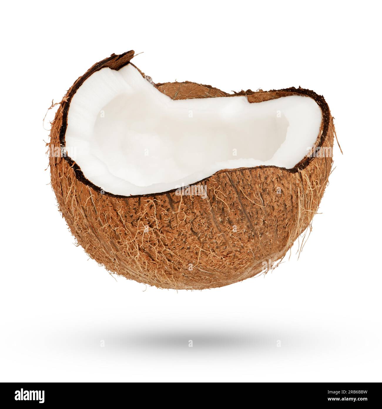 Broken coconut on a white isolated background. Half of a coconut, flesh ...