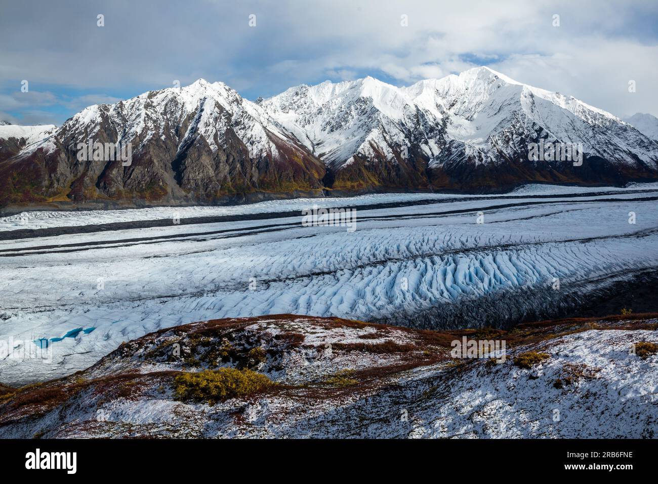 Fog Peak, right, stands in the sun with fresh snow in early September ...