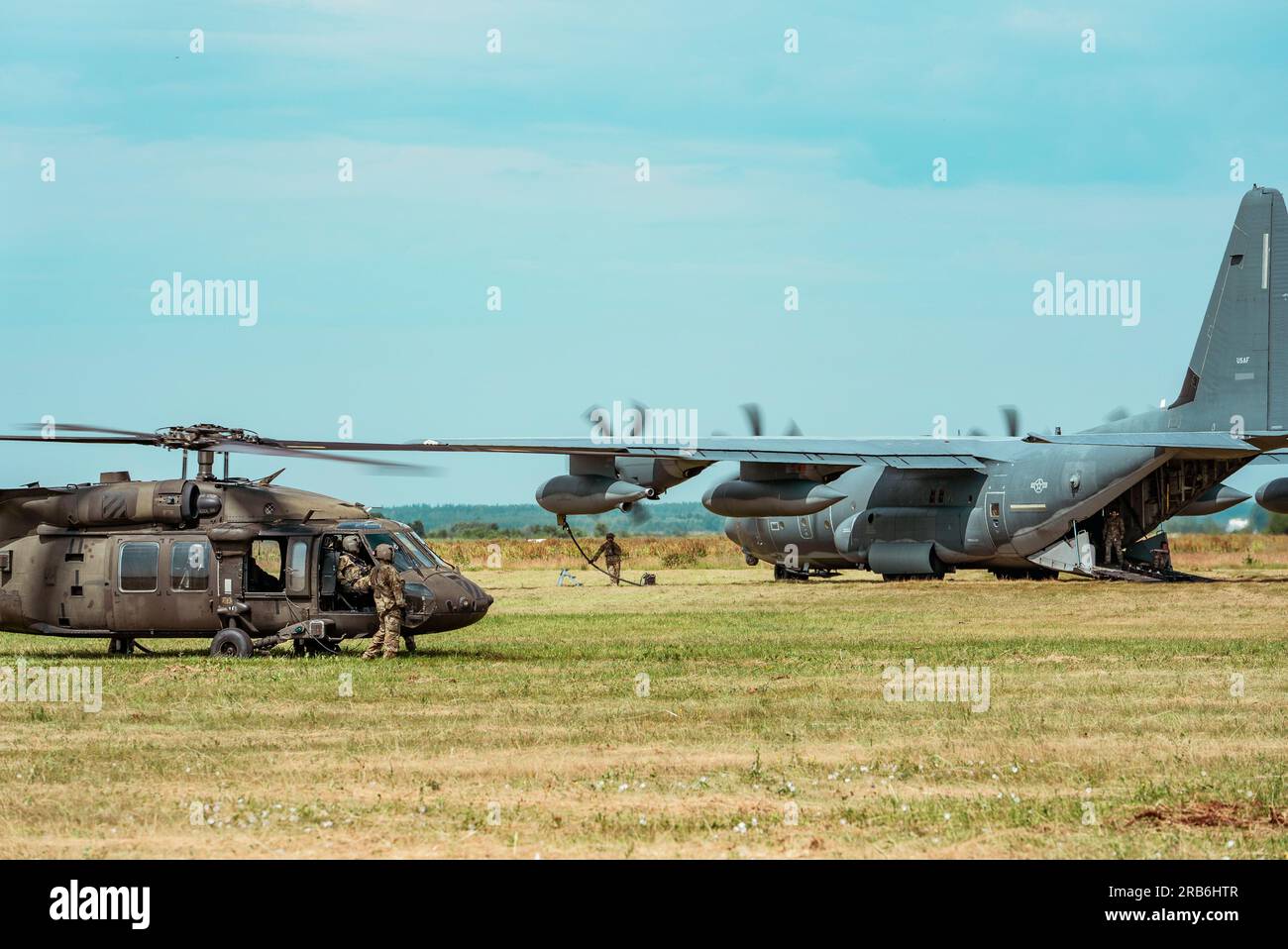 U.S. Air Force Forward Area Refueling Point specialists refuel a U.S ...