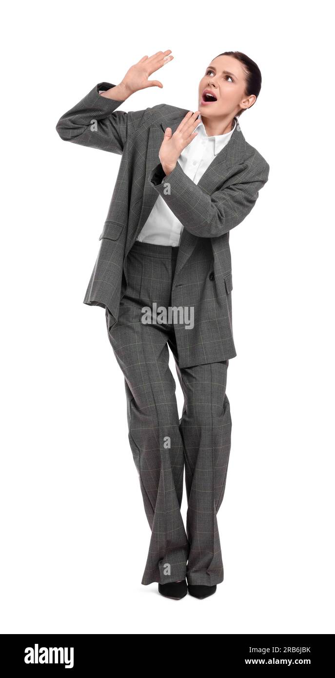 Beautiful emotional businesswoman in suit avoiding something on white ...