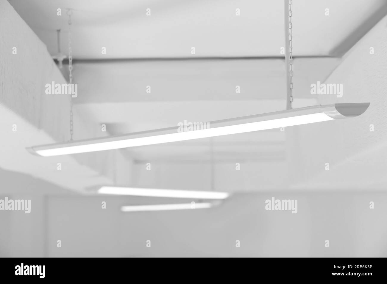 White ceiling with modern lighting in room Stock Photo - Alamy