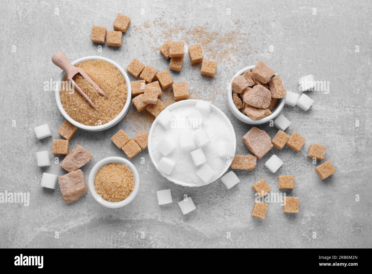 Different types of sugar on grey table, flat lay Stock Photo - Alamy