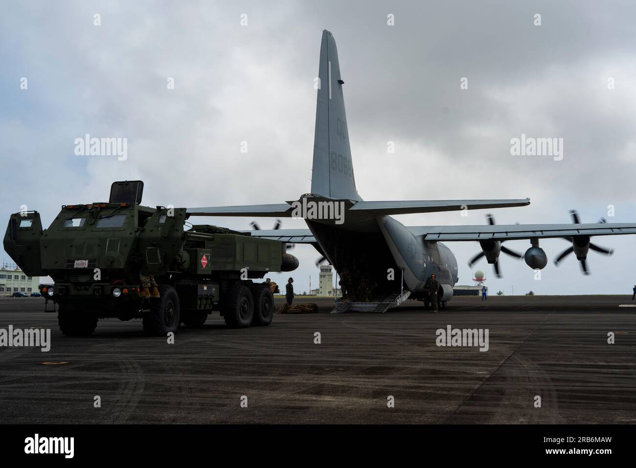U.S. Marines with Marine Aerial Refueler Transport Squadron (VMGR) 152 offload an M142 High ...