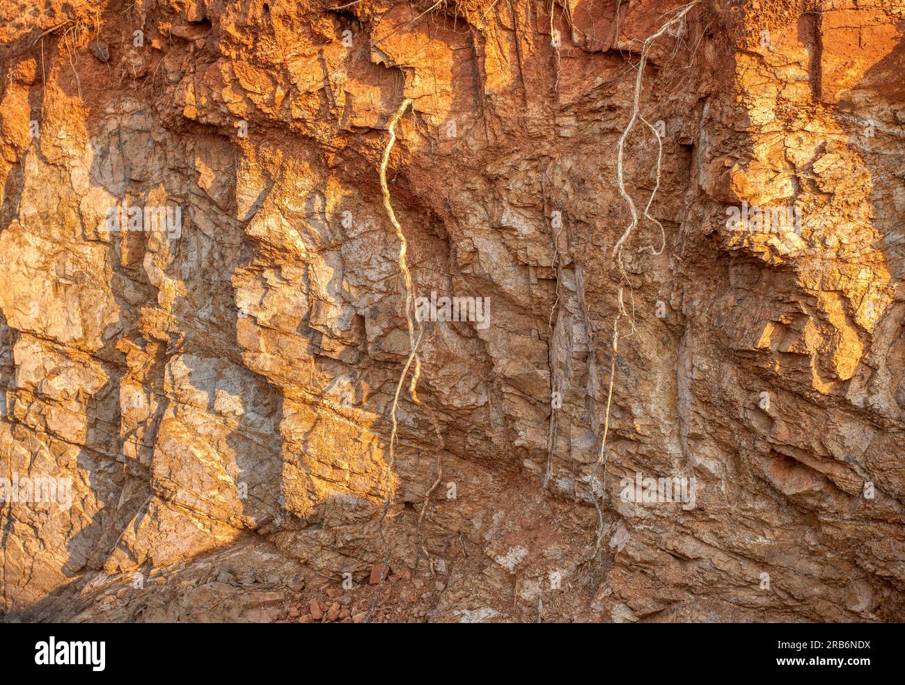 organic texture, african landscape eroded red granite rock by the water ...