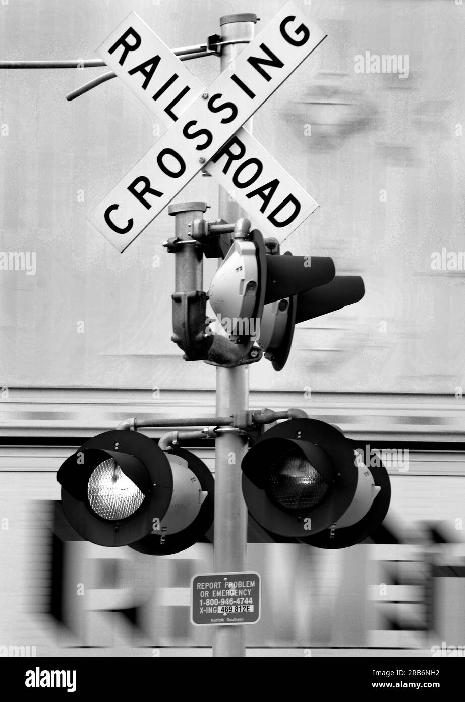 A freight train travels past a highway railroad crossing in Abingdon ...