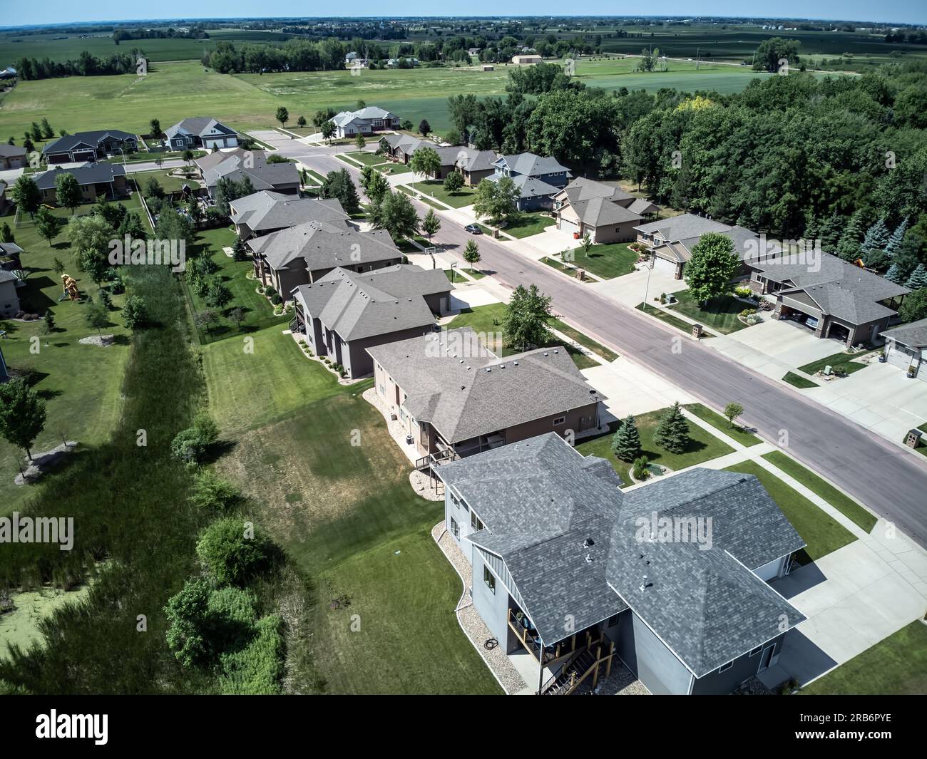 Drone view over marsh wetland and cattails in a drainage area between ...