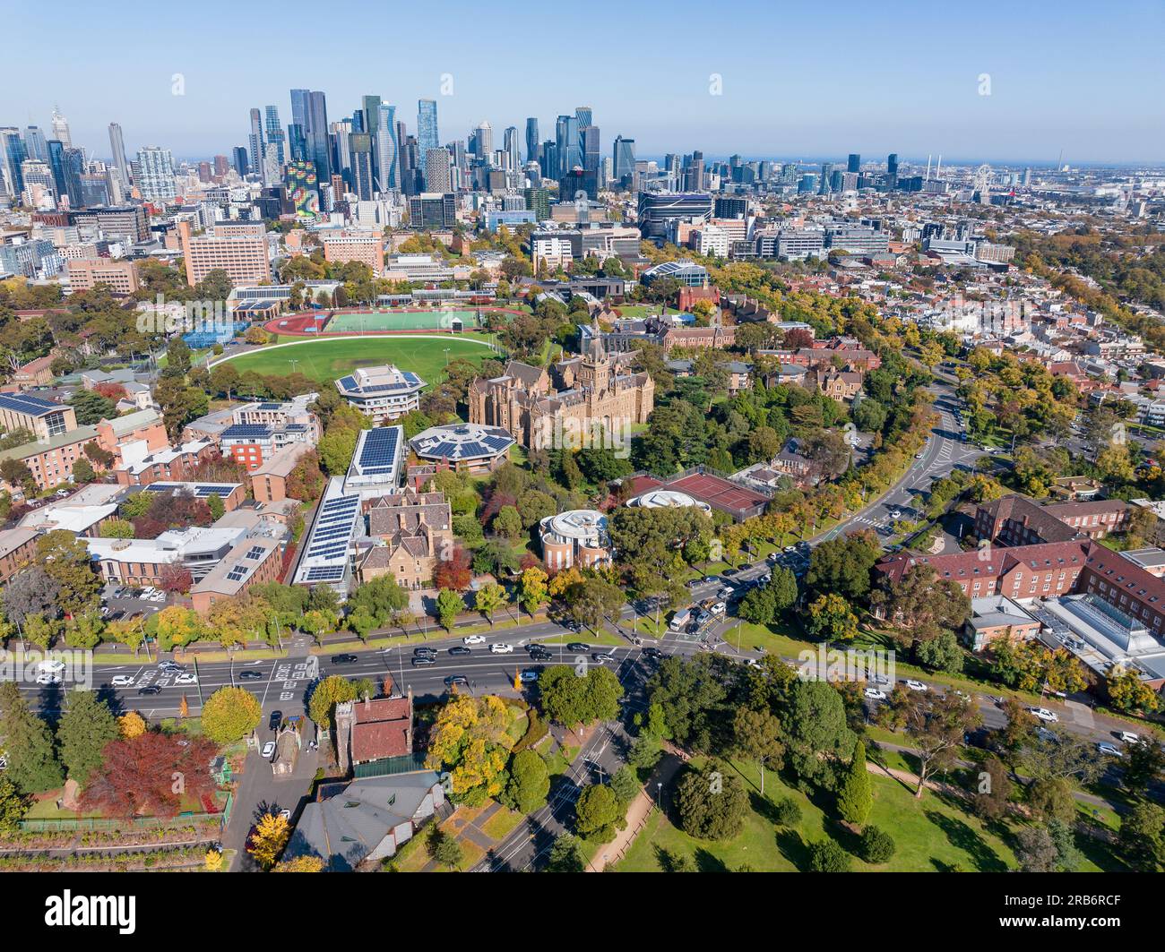 Aerial view of a leafy city suburb with historic buildings and a city ...