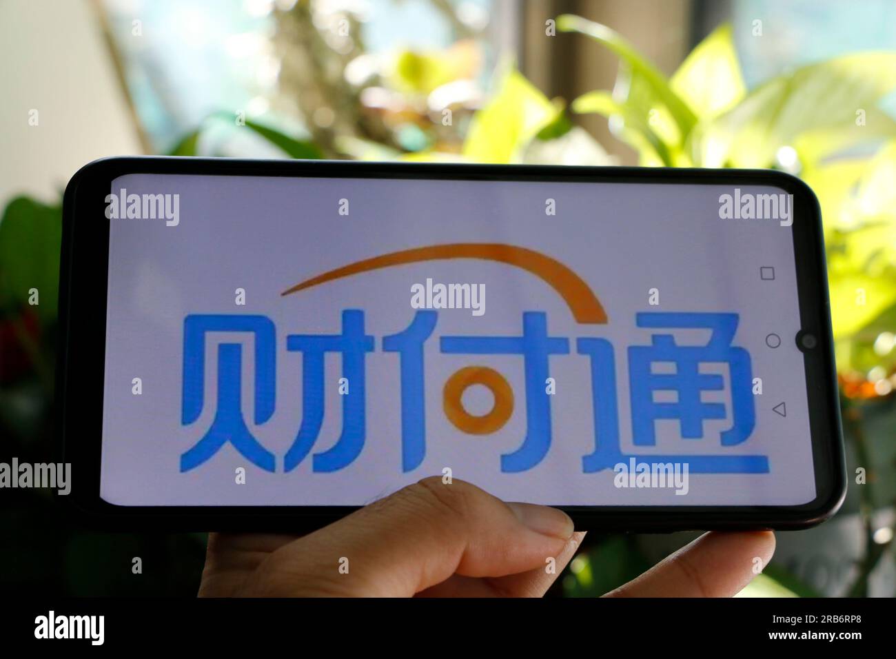 BEIJING, CHINA - JULY 8, 2023 - A citizen checks a Tenpay logo in ...
