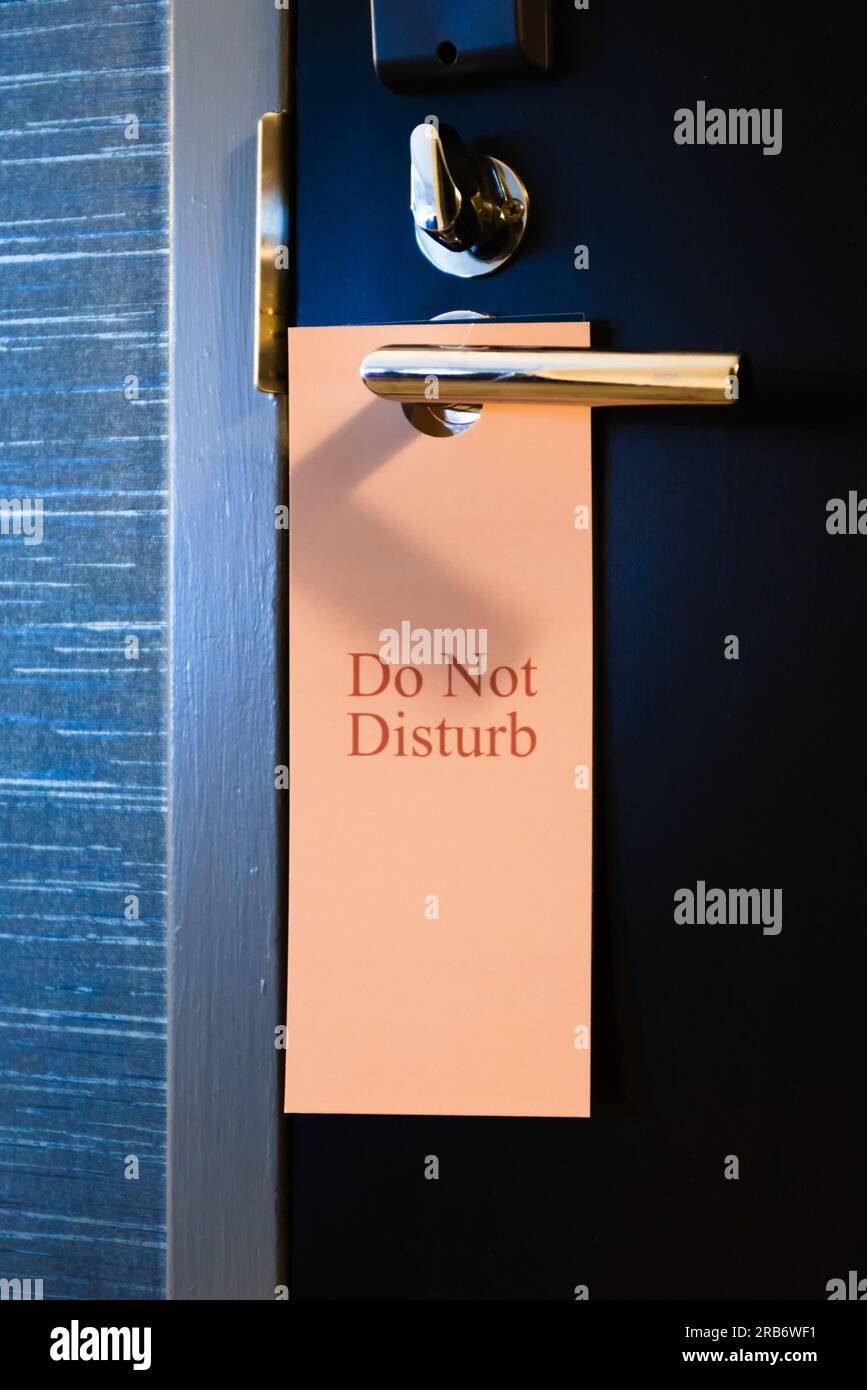 Classic American hotel door sign. Do Not Disturb. Sign hangs on a sleek ...