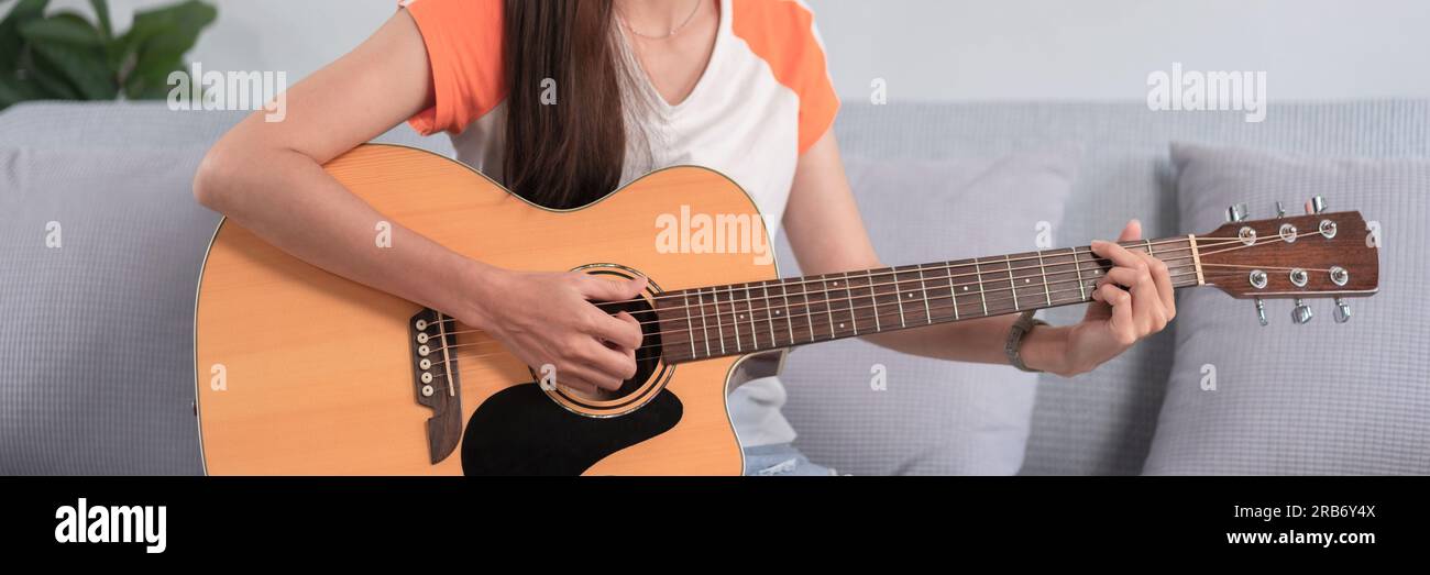 Hobby concept, Young asian woman sitting on couch to singing and ...