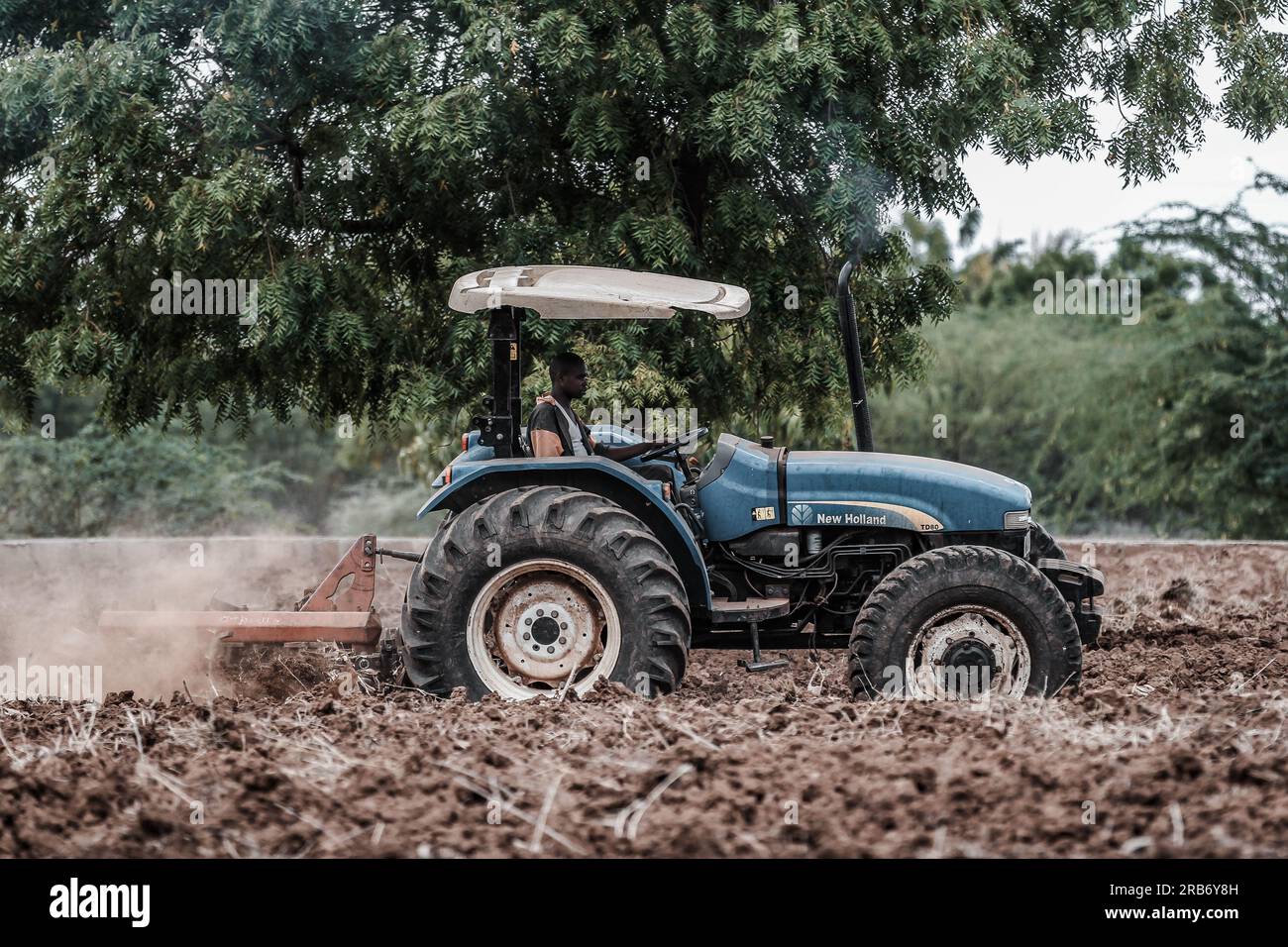 Tractor plowing farmland farming in Kenya Landscapes East Africa Stock ...