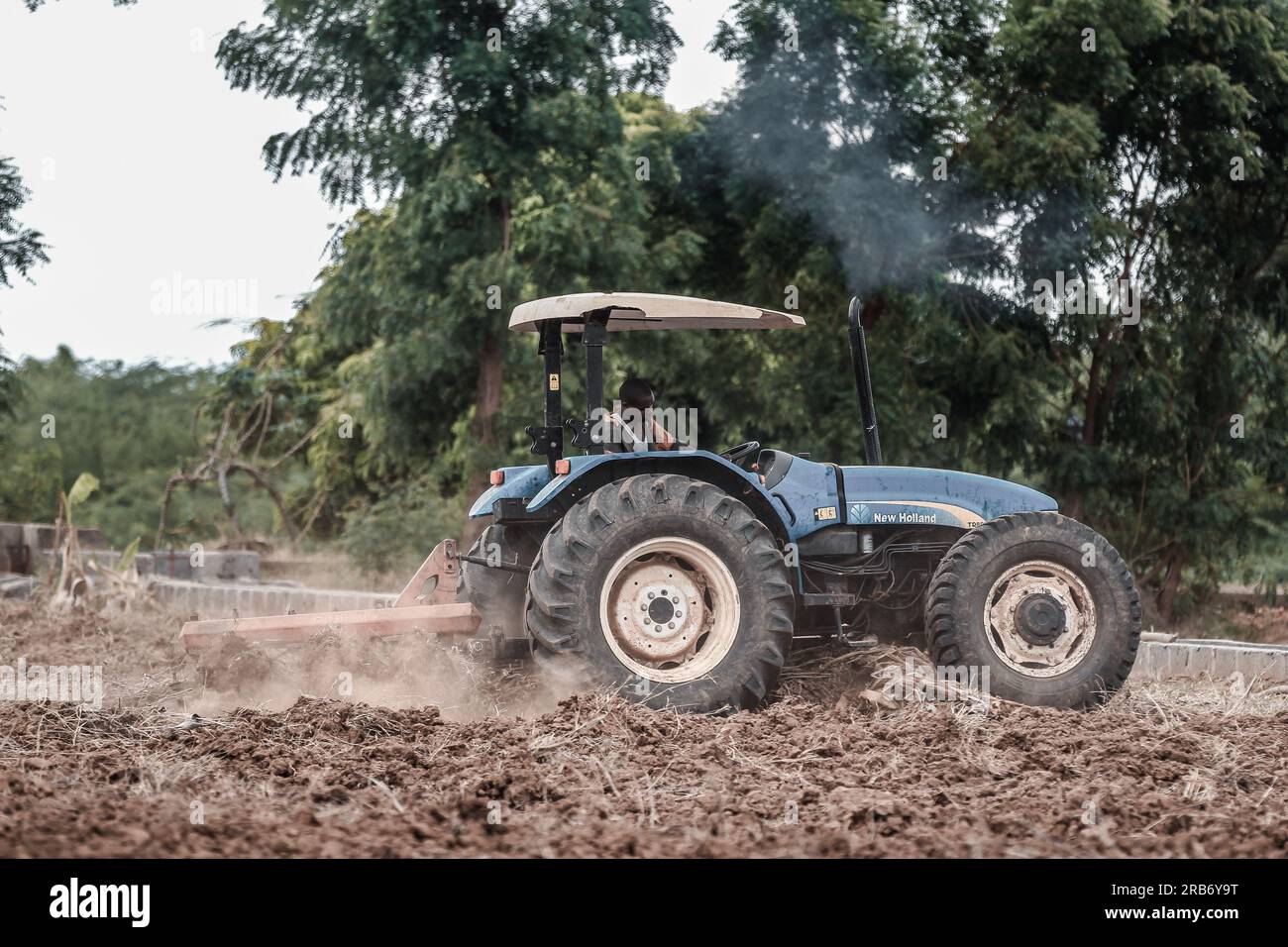 Tractor plowing farmland farming in Kenya Landscapes East Africa Stock ...