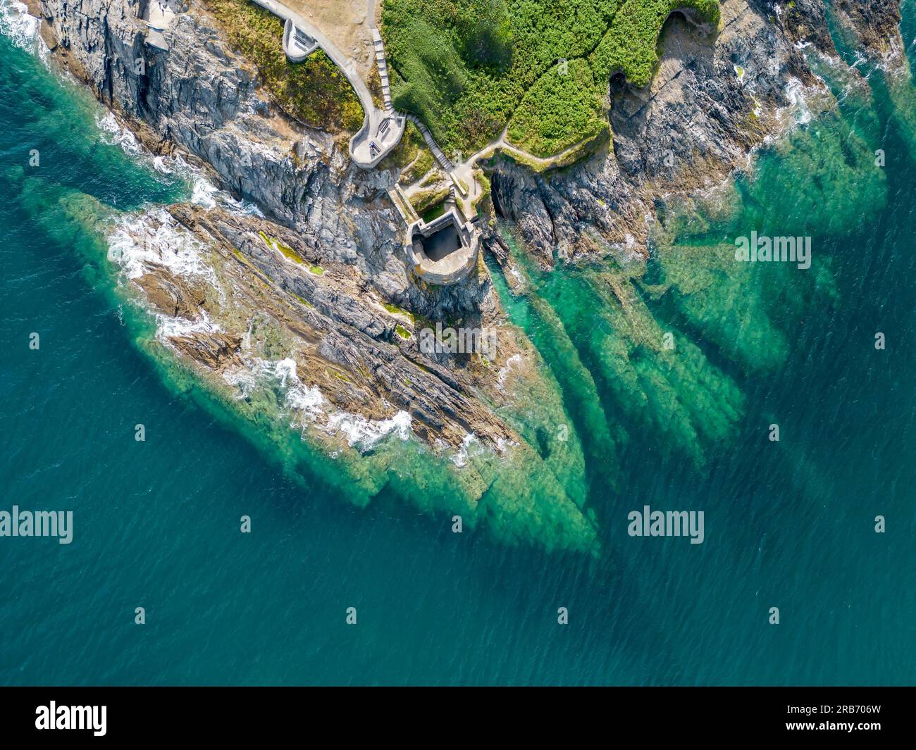 An aerial view looking down at the rocky coast of Pendennis Point near ...