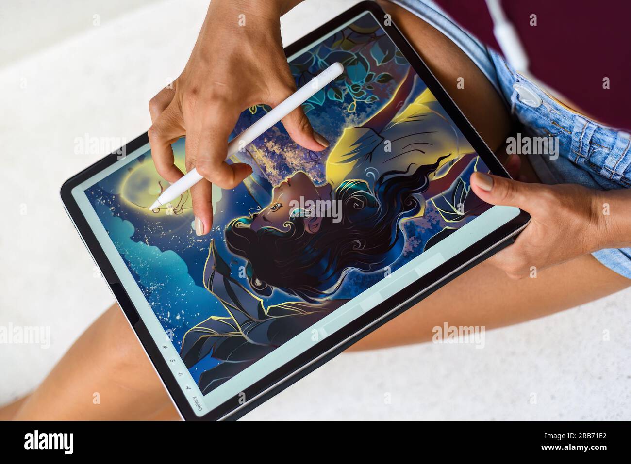 Brunette woman artist and illustration drawing, using electronical ...