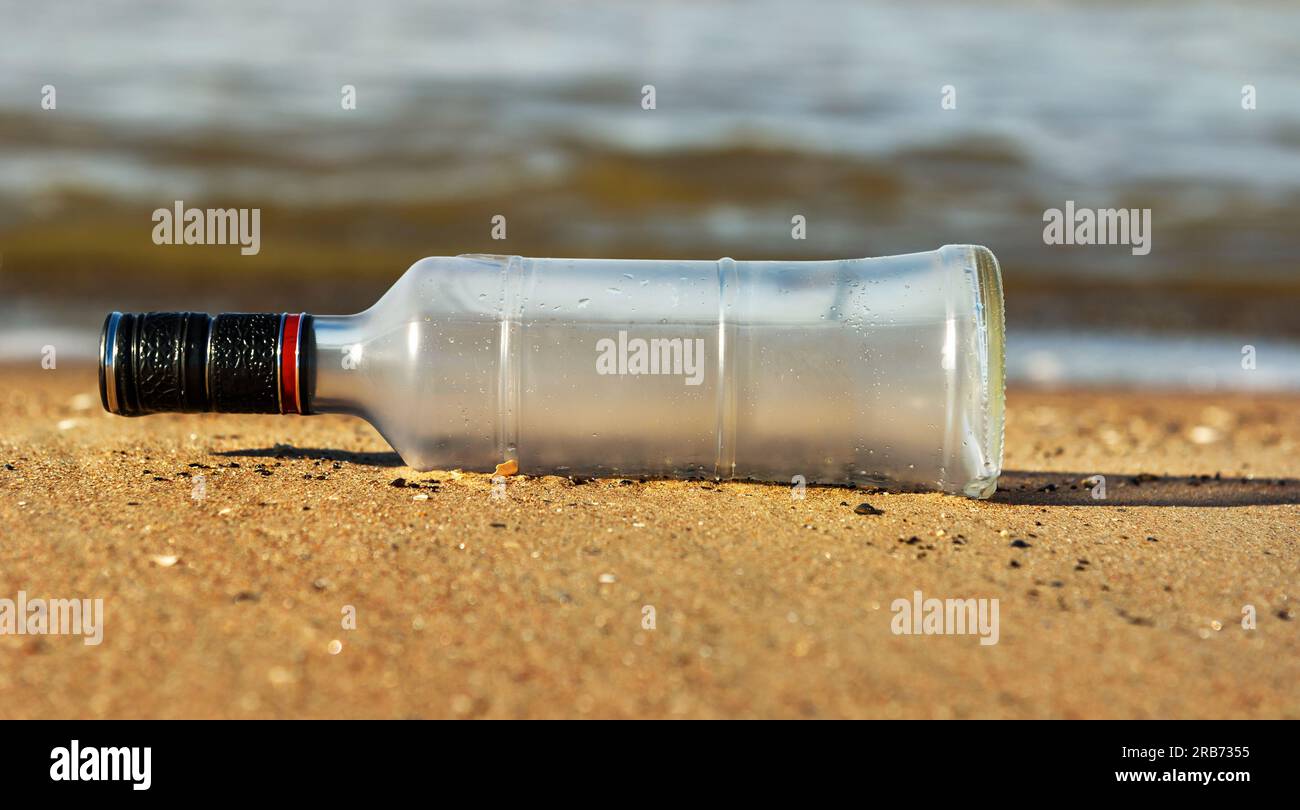 Empty bottle alcohol on beach hi-res stock photography and images - Alamy