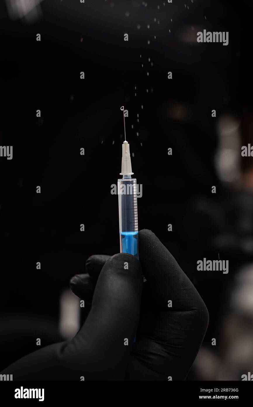 doctor holding a syringe with a needle. syringe with needle Stock Photo ...