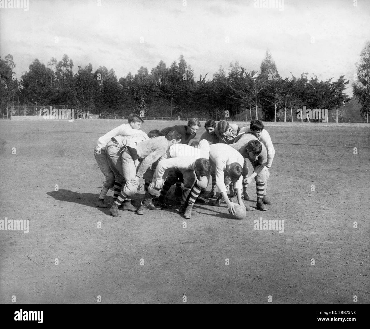 California: c. 1894 A Bay Area football team in the flying wedge ...