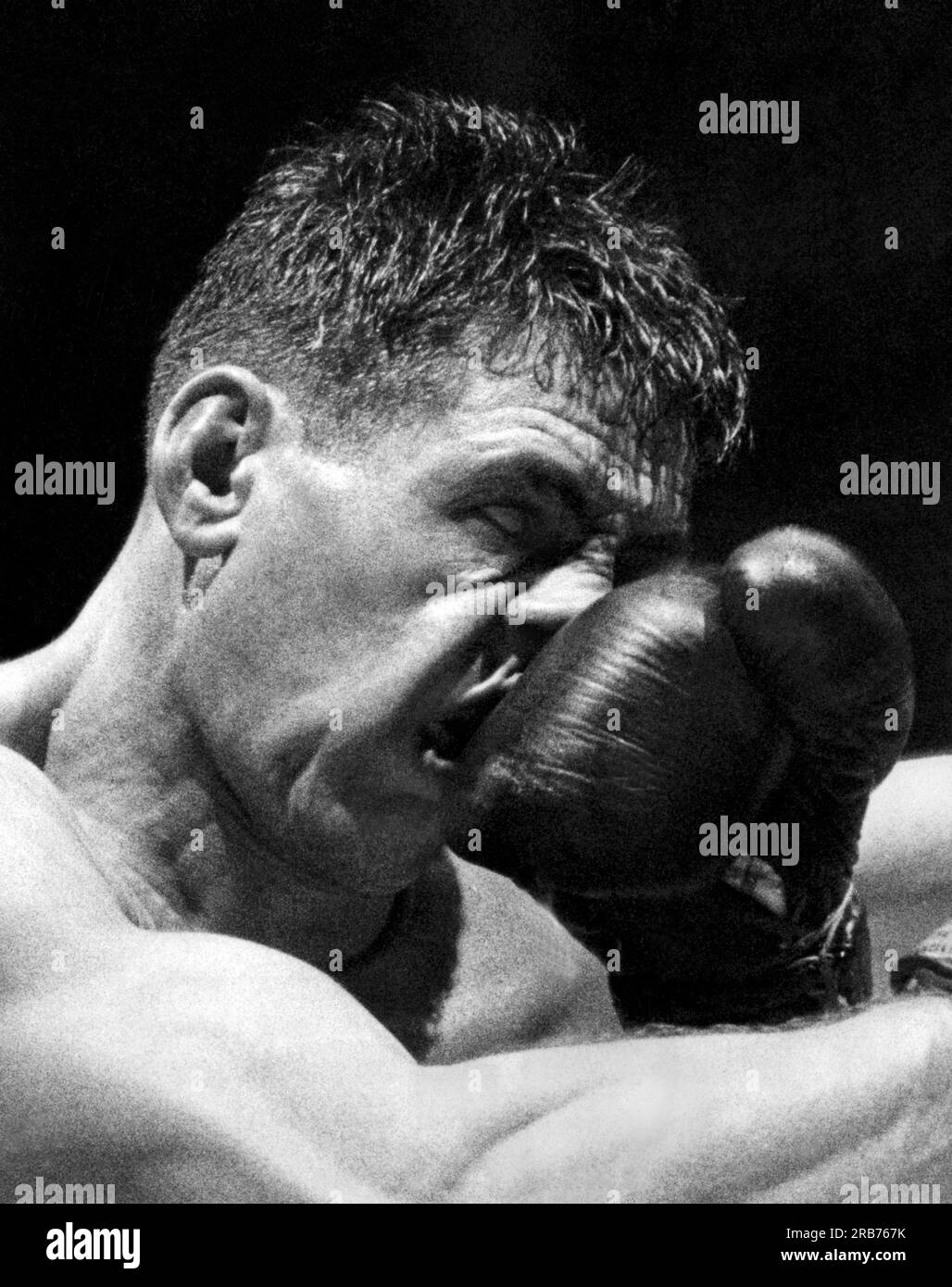 New York, New York: February, 1953. Rocky Castellani takes a right in ...
