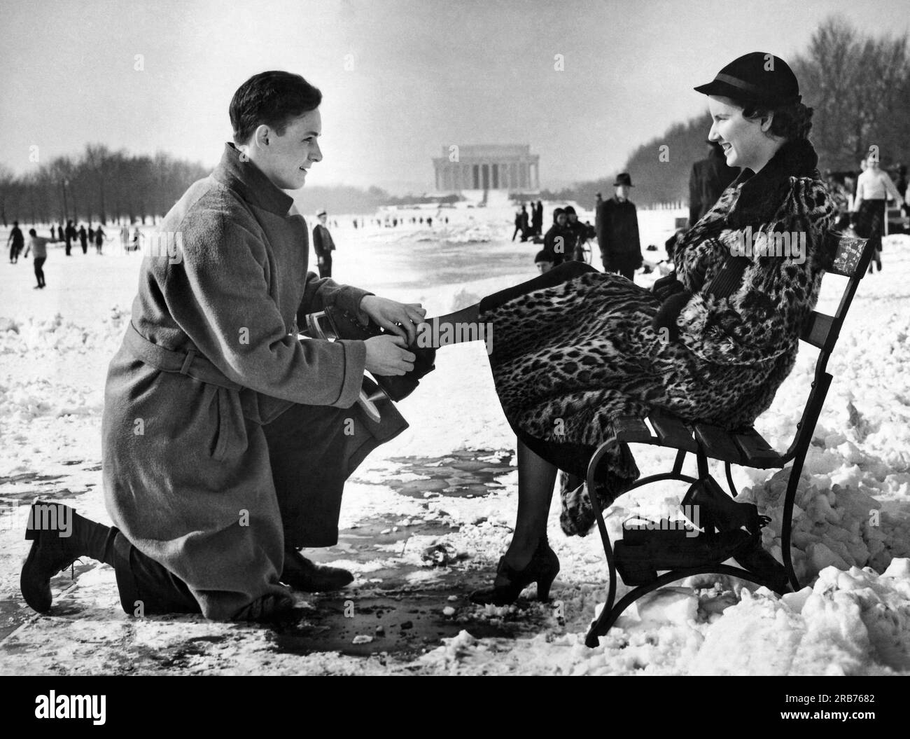 Washington D.C.: January 2, 1936. A young man assists a young woman in ...
