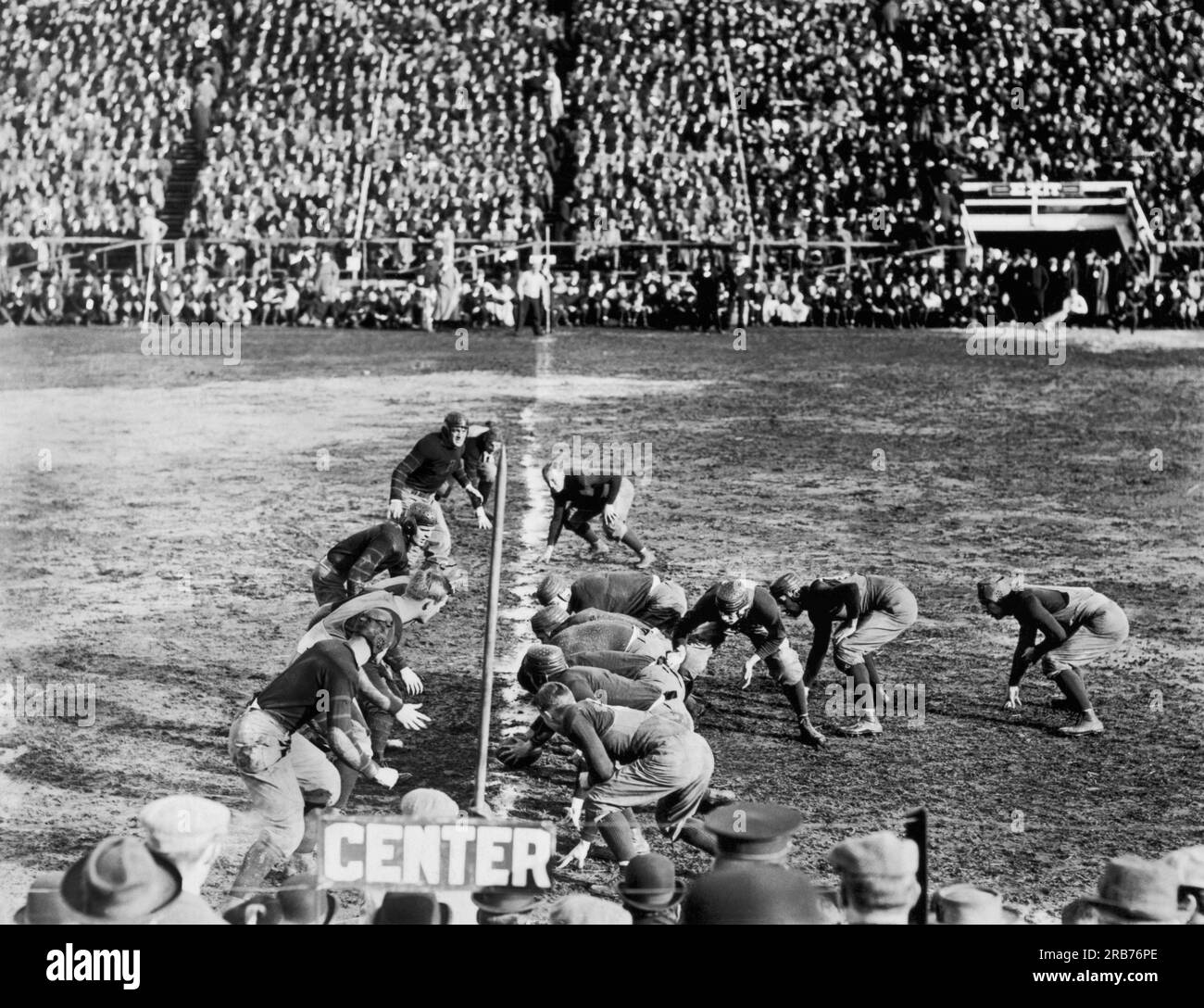 United States: c. 1912 Two football teams on the line of scrimmage and ...