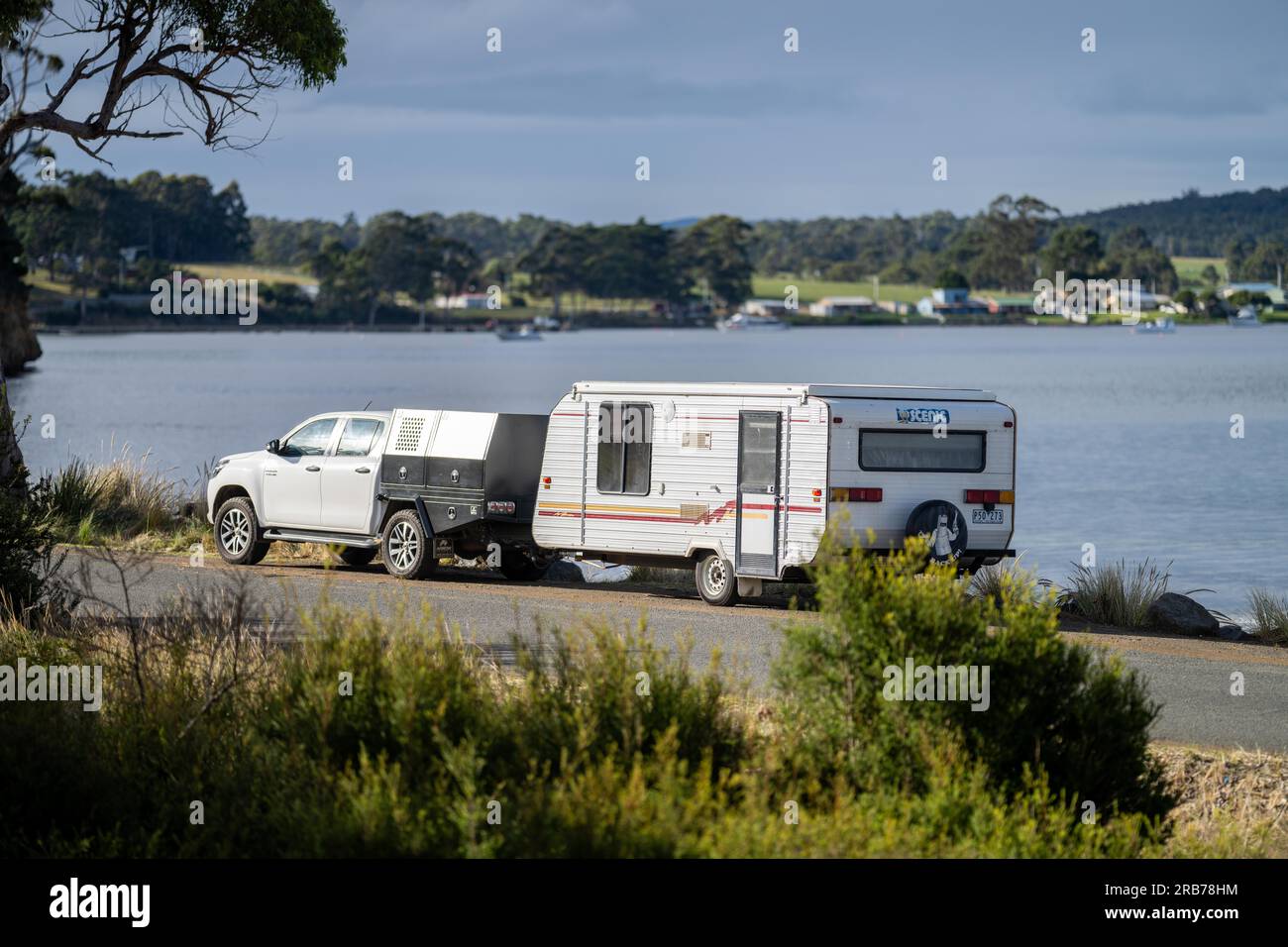 caravan on the road. parked by the baeach in summer. towing a caravan ...