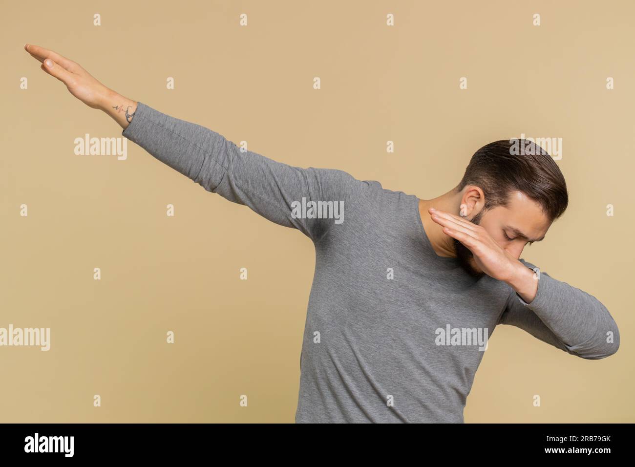 Trendy cheerful lebanese man having fun dancing and moving to rhythm ...