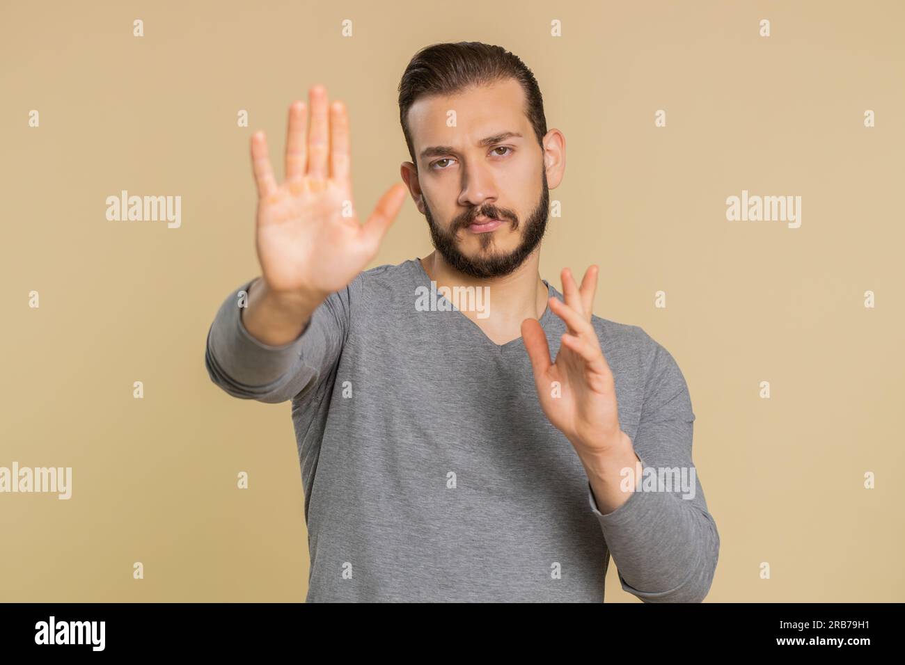 Lebanese man say No hold palm folded crossed hands in stop gesture ...